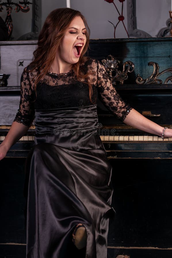 Elegance and Emotion: a Dramatic Performance at the Piano Stock Image ...