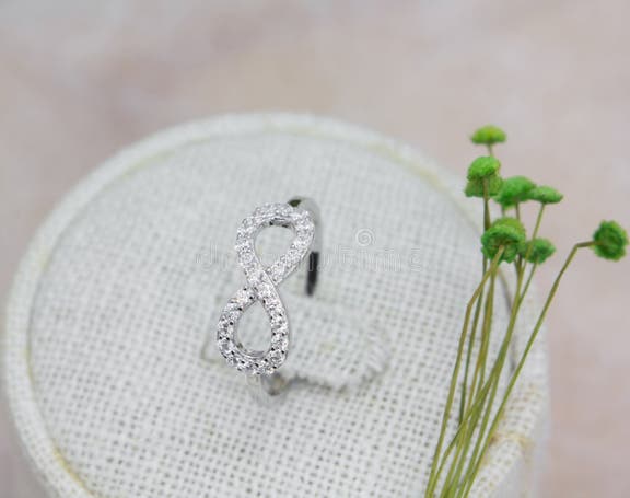 Elegance Infinity Shape Ring Decorated with Diamonds Stock Image ...