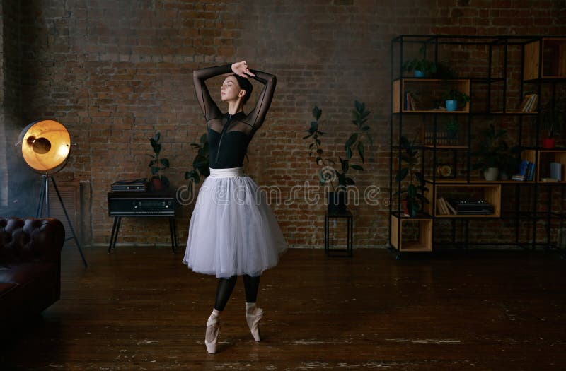 An Elegant Ballet Performance in a Modern Studio Showcases Artistry and ...