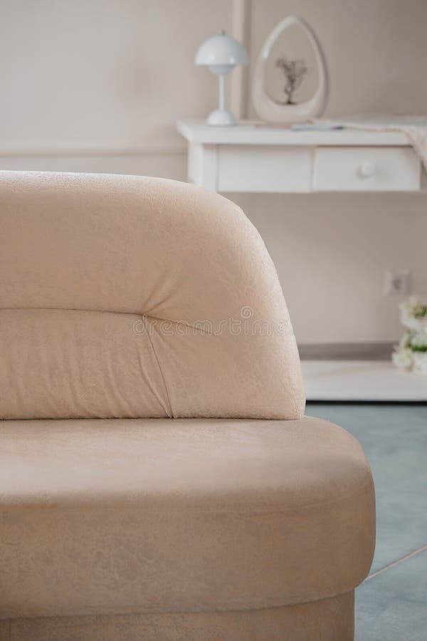 Elegant Beige Curved Sofa in a Light-toned Interior, Featuring a ...