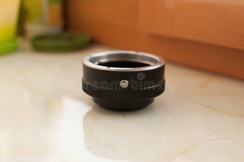 Elegant Black Photography Lens Adapter on Polished Surface Stock Photo ...