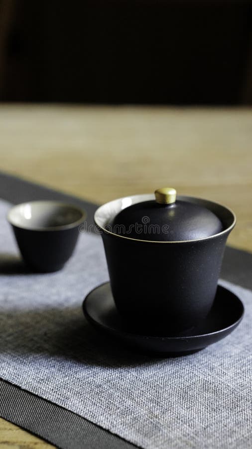 An Elegant Black Tea Set Displayed on a Minimalist Dining Table ...
