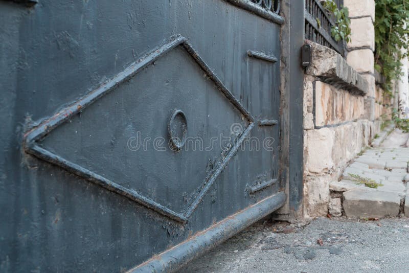 Elegant Blue Gate with Intricate Design in Quaint Stone Pathway Stock ...