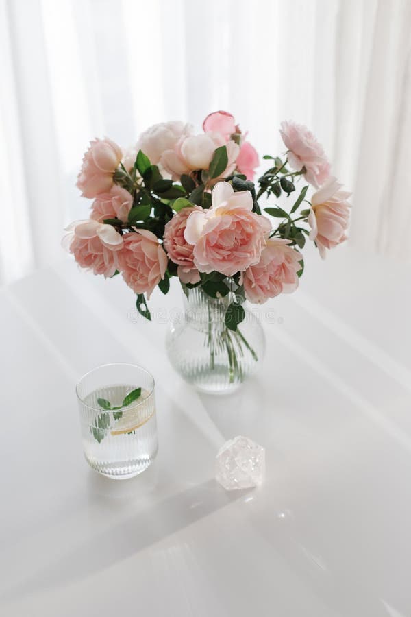 An Elegant Bouquet of Fresh Roses and Placed by a Light-filled Window ...