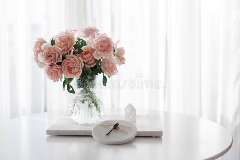 An Elegant Bouquet of Fresh Roses and Placed by a Light-filled Window ...