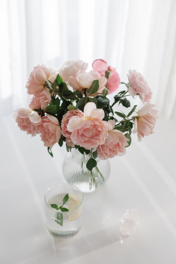 An Elegant Bouquet of Fresh Roses and Placed by a Light-filled Window ...