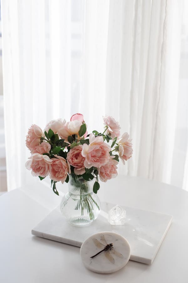 An Elegant Bouquet of Fresh Roses and Placed by a Light-filled Window ...