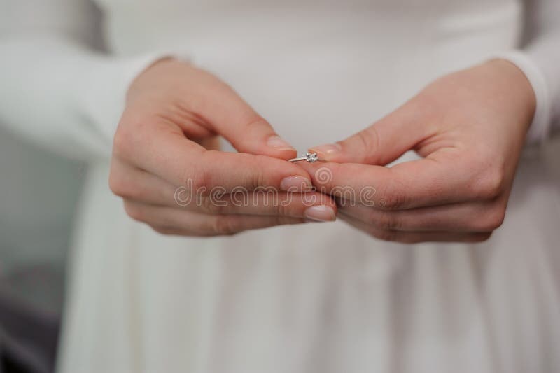 Elegant Bridal Hands Holding a Delicate Ring Stock Photo - Image of ...