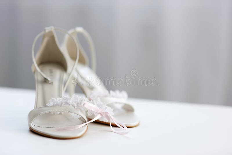 Elegant Bridal Shoes and a Garter Stock Photo - Image of pink, wedding ...