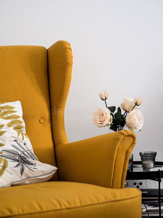 Elegant Brown Couch with a Vase of White Roses on a Table Stock Photo ...