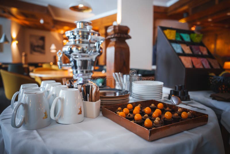 Elegant Buffet Setup with Dining Table, Beverage Dispenser, and Variety ...