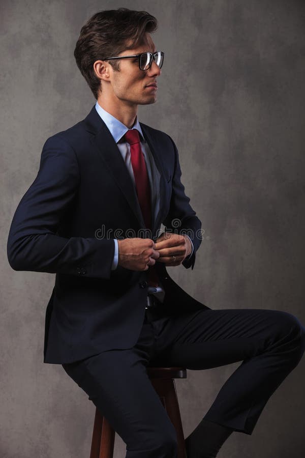 Elegant Business Man Buttoning His Suit while Sitting Stock Photo ...