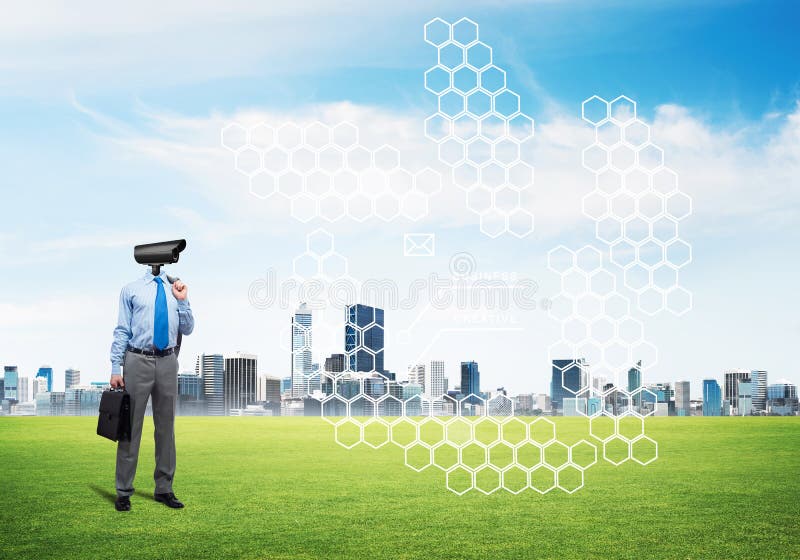 Camera Headed Man Standing on Green Grass Against Modern Cityscape ...