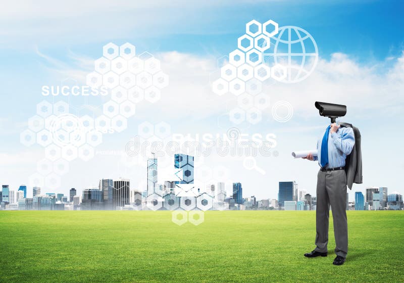 Camera Headed Man Standing on Green Grass Against Modern Cityscape ...