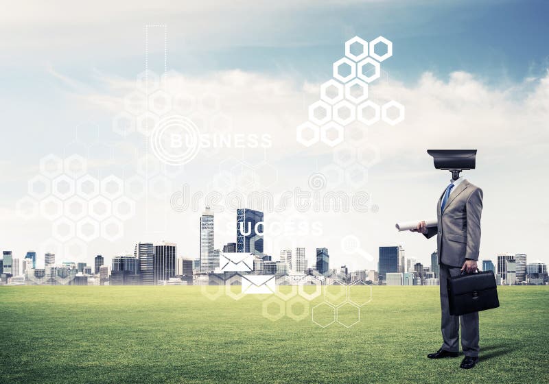Camera Headed Man Standing on Green Grass Against Modern Citysca Stock ...