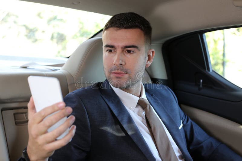 Elegant Car Passenger Using Phone Stock Photo - Image of elegant, male ...