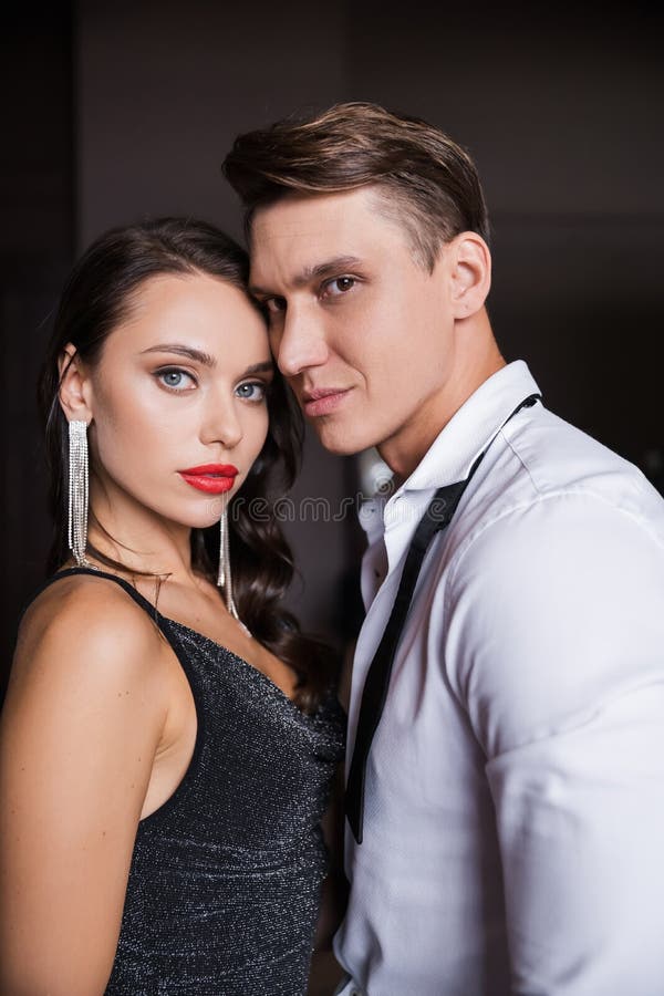 Elegant Couple Looking at Camera at Stock Photo - Image of boyfriend ...