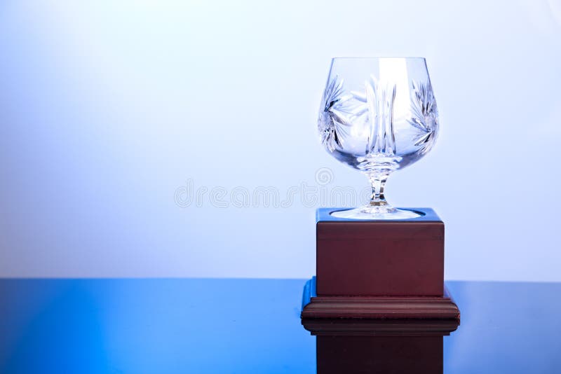 Elegant Crystal Cup Trophy on Blue Hue Ambient Stock Photo - Image of ...