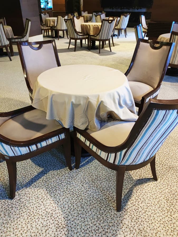 Elegant Dining Chairs and Round Table in Restaurant Interior Stock ...