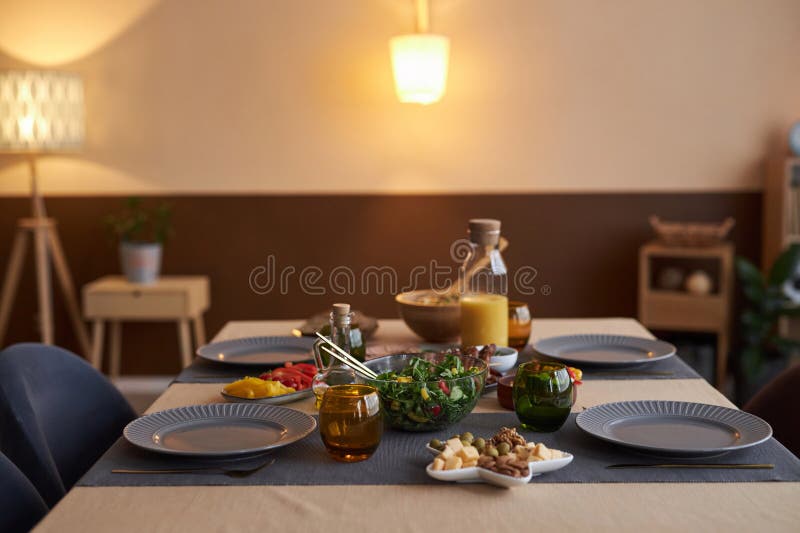 Elegant Dining Room Table with Plates Stock Photo - Image of interior ...
