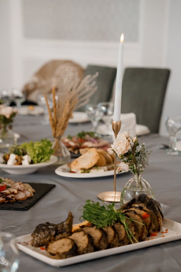 Elegant Dining Table Setting with Gourmet Dishes and Candlelight Stock ...