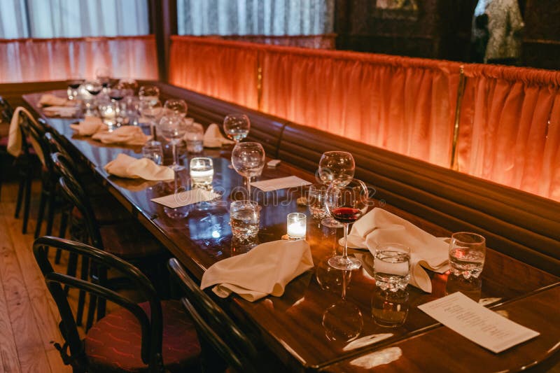 Elegant Dinner Setup with Candlelight at a Restaurant during Evening ...