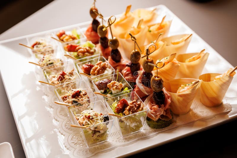 An Elegant Display of Various Appetizers on a White Platter Stock Image ...