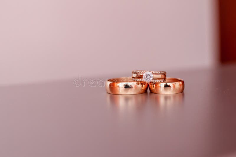 Elegant Display of Wedding Rings on a Reflective Surface Stock Image ...
