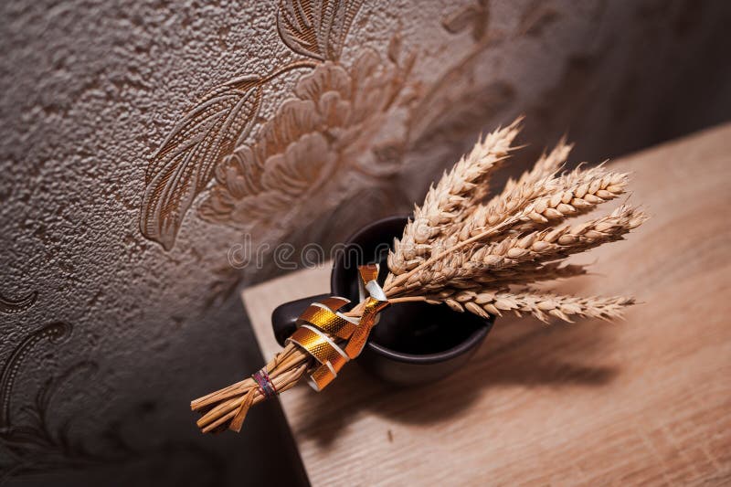 Elegant Dried Wheat Bundle in a Rustic Ceramic Vase on Wooden Surface ...