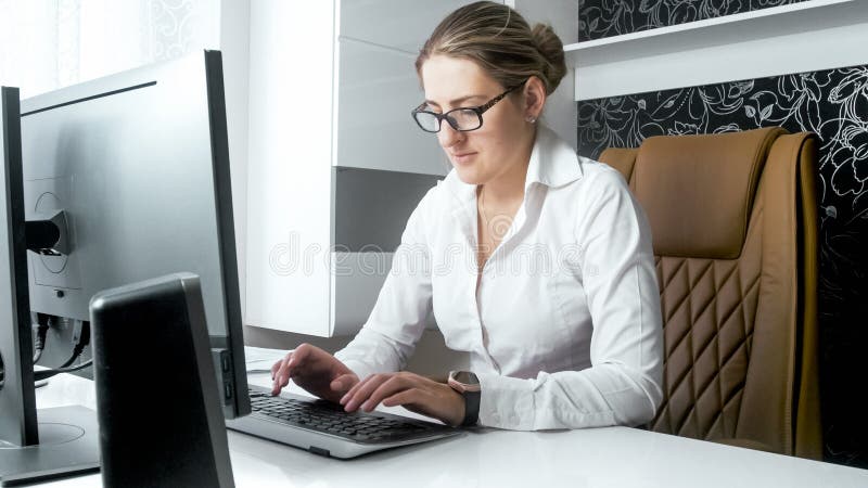 Portrait of Elegant Female Manager Typing Text on Computer Keyboard ...