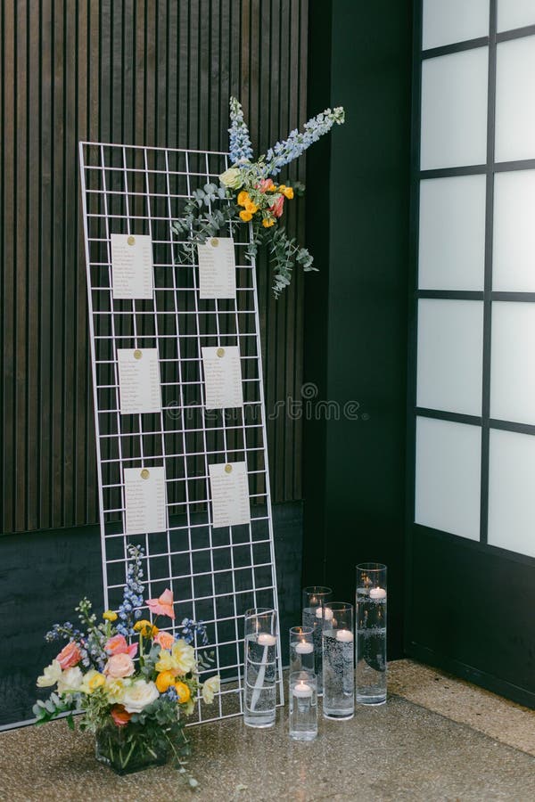Elegant Floral Display and Seating Chart Setup at a Modern Event Space ...