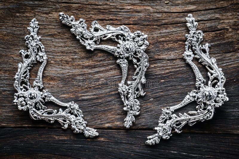 An Elegant Frame Made of Silver Stucco Plaster Lying on a Dark Wood ...