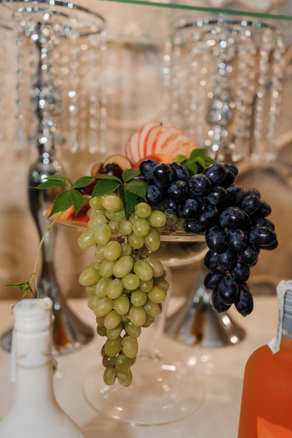 Elegant Fruit Display with Grapes and Decor Stock Image - Image of ...
