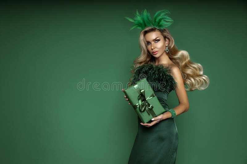Elegant Glamour Model in Green Evening Dress on Green Background in ...