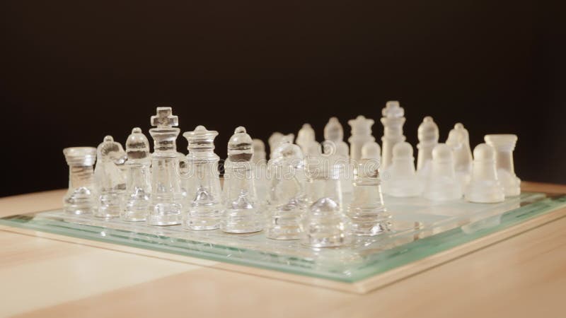 Elegant Glass Chess Set on Display with a Dark Background Stock Footage ...