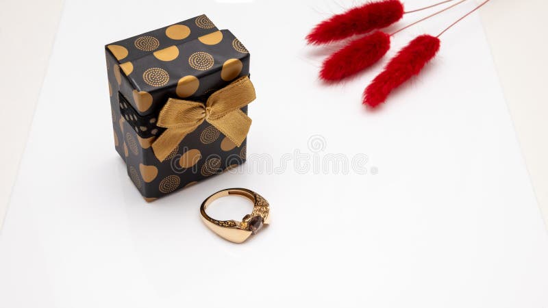Elegant Gold Ring with Gemstone and Gift Box Stock Photo - Image of ...