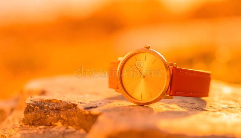 Elegant Gold Watch on Textured Slate with Warm Light Reflections Stock ...