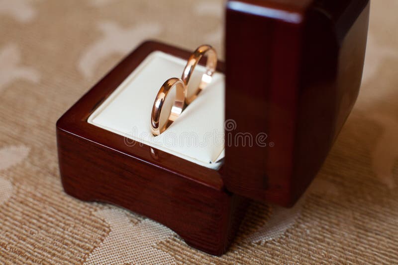 Elegant Gold Wedding Rings in a Wooden Box Stock Photo - Image of ...