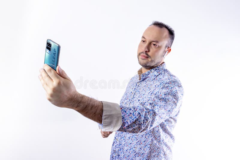 Elegant Guy with Headphones Making a Video Call at White Background ...