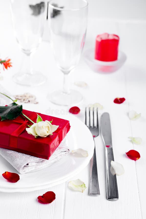 Elegant Holiday Table Setting with Red Ribbon Gift Stock Image - Image ...