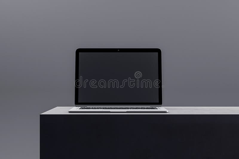 Elegant Laptop on a Black Podium Featuring a Dark Screen, Suitable for ...