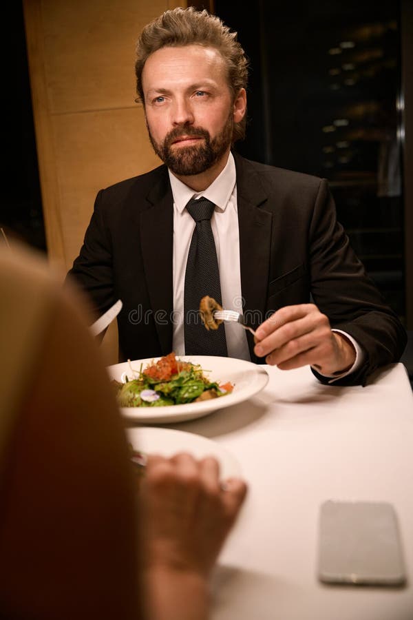 Elegant Man with a Beard is Having Dinner in Restaurant Stock Image ...