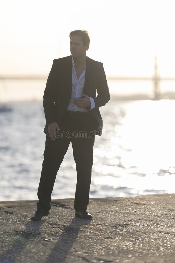 Elegant Man Dancing Alone by the Sea at Sunset Stock Photo - Image of ...