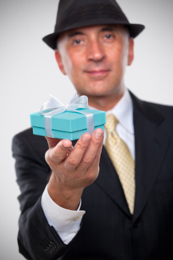 Elegant Man Holding a Present Stock Photo - Image of give, paper: 63483566