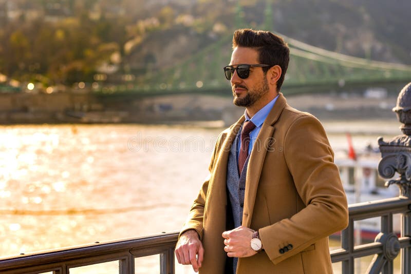 An Elegant Man Standing Next To a River Stock Photo - Image of ...