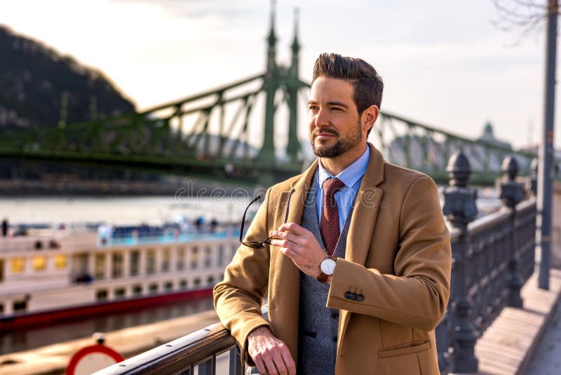 An Elegant Man Standing Next To a River Stock Photo - Image of river ...