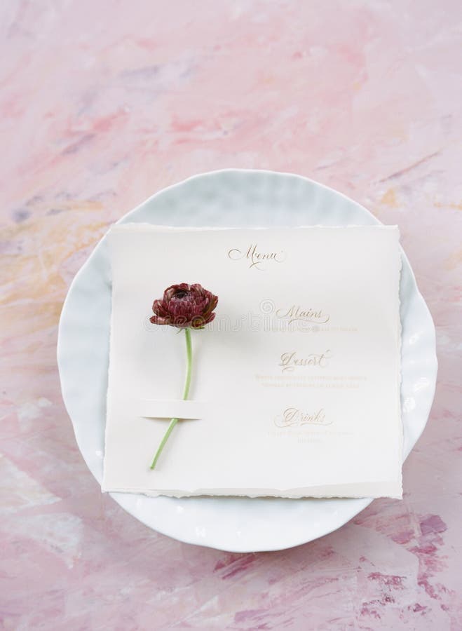 Elegant Menu Presentation with a Dried Flower on a Textured Plate Stock ...