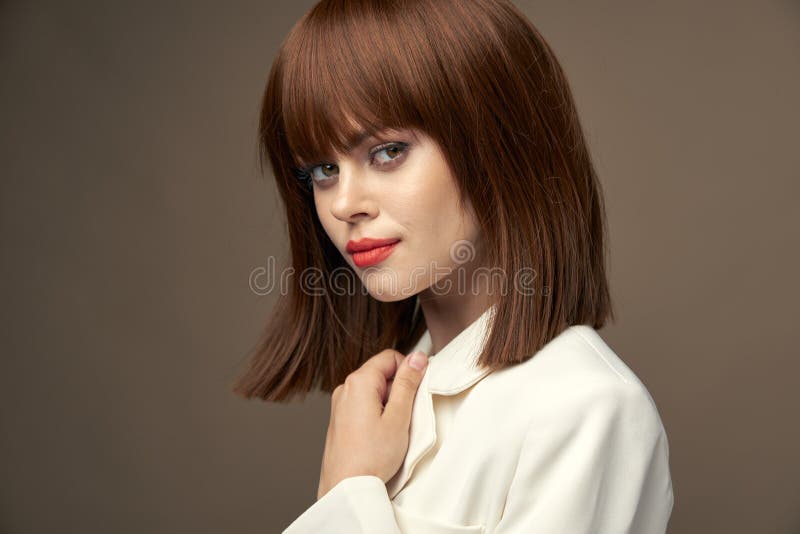 Elegant Model in Beige Jacket Pose for the Camera Stock Photo - Image ...