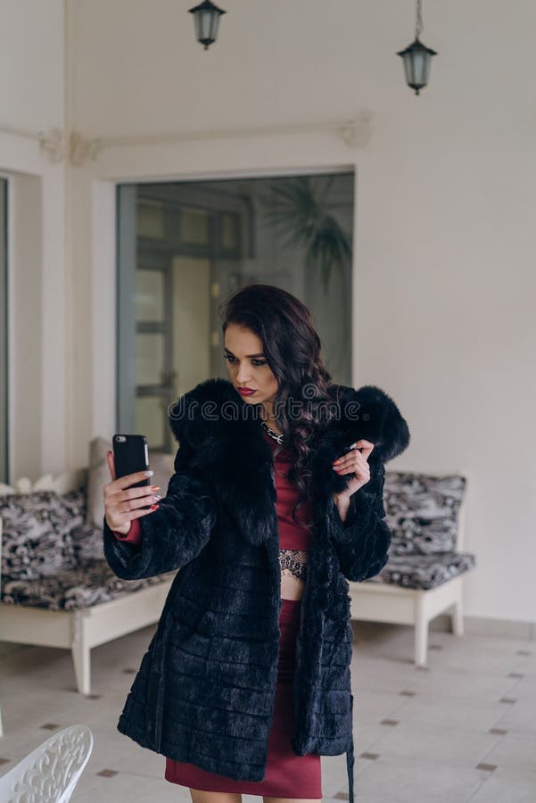 Elegant Model in Black Coat with Phone Stock Photo - Image of caucasian ...