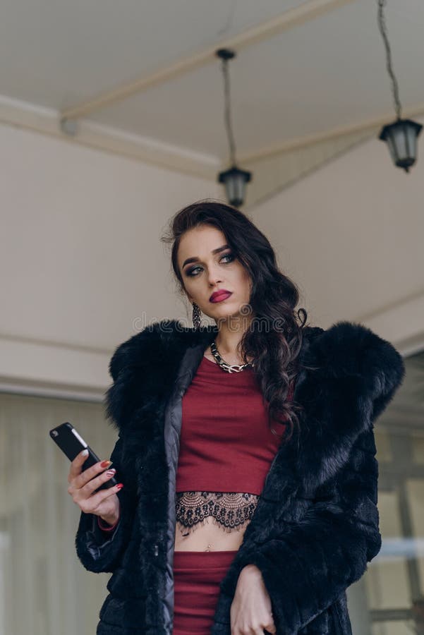 Elegant Model in Black Coat with Phone Stock Photo - Image of black ...